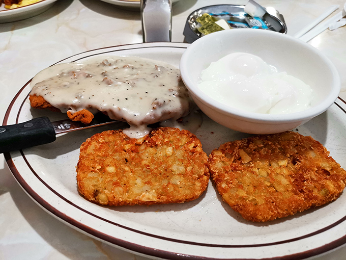 The chicken fried steak doesn't just come with gravy&mdash;it swims in it. This isn't a meal; it's a life event with crispy potatoes standing by. 