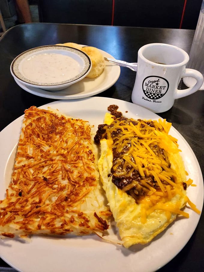 Breakfast nirvana: golden hash browns with architectural-level crispiness alongside a fluffy omelet that's basically a cheese delivery system.
