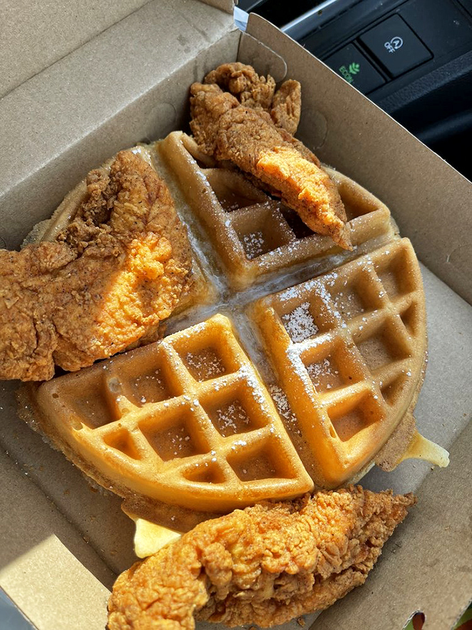 Breakfast or dinner? Yes, please! Golden-brown chicken nestled against a perfectly grid-marked waffle&mdash;the ultimate to-go indulgence.