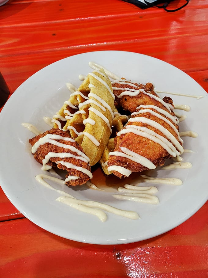 Golden-fried chicken perched atop a cornbread waffle, drizzled with aioli &ndash; it's like comfort food got dressed up for the prom.