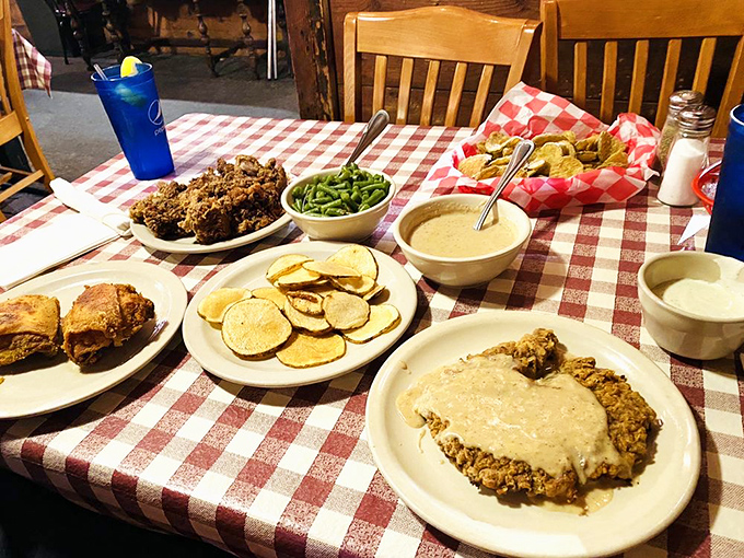 A table that could make a cardiologist wince but a soul sing. That chicken fried steak isn't just dinner&mdash;it's therapy with gravy.