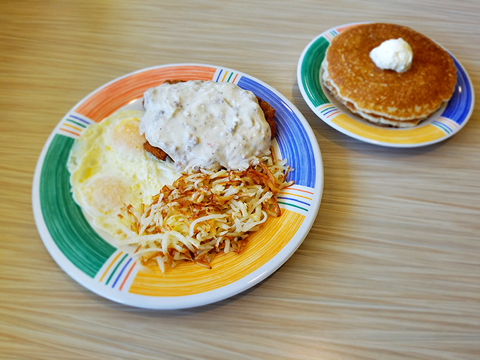 Breakfast nirvana achieved: golden-brown chicken fried steak smothered in country gravy, with eggs and hash browns playing perfect supporting roles.