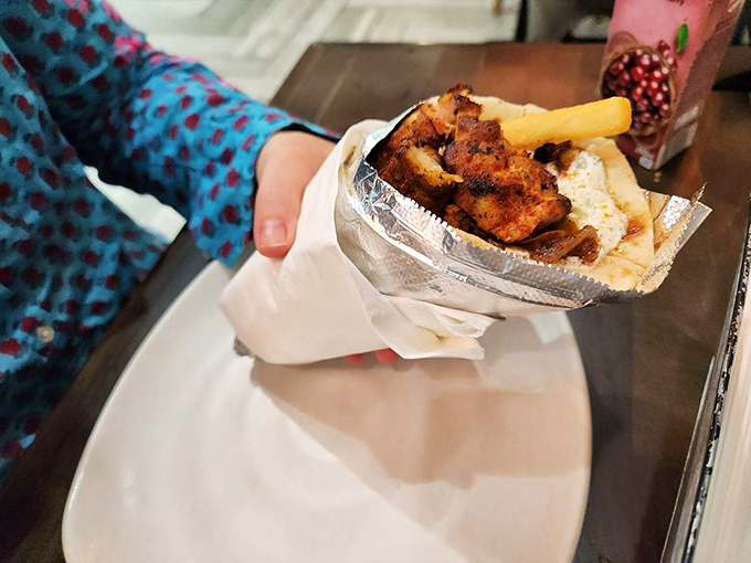 This chicken gyro isn't just a sandwich; it's a perfectly engineered handheld masterpiece where crispy, seasoned meat meets cool tzatziki in pillowy pita perfection.