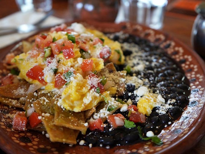 Chilaquiles that could make a grown person weep with joy. Those perfectly simmered tortilla chips cradling eggs and salsa are what breakfast dreams are made of.