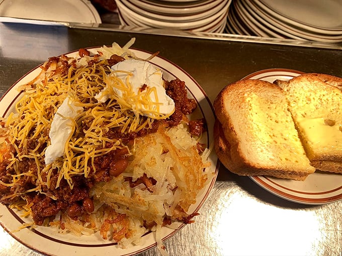 Chili cheese hash browns that make you question every other breakfast decision you've ever made. That toast is just there for moral support.