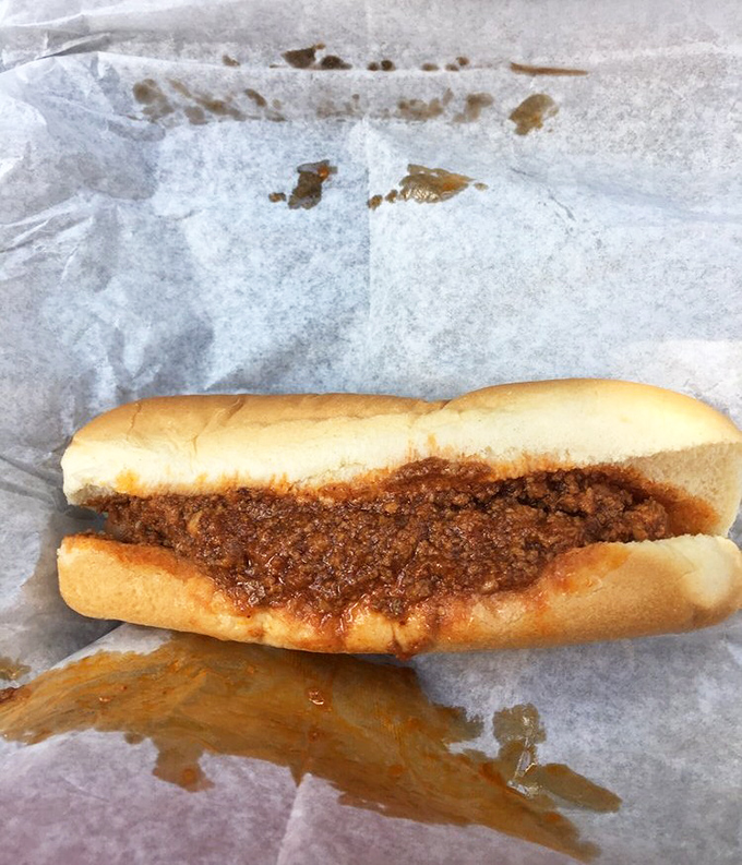 Chili dog perfection in its natural habitat. This isn't just lunch&mdash;it's a savory symphony on a soft bun that makes fast food chains weep with envy.