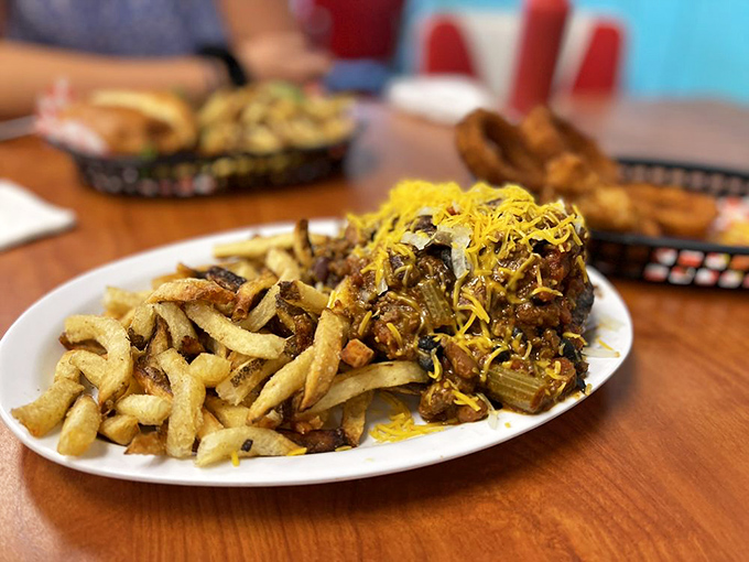 Chili fries that don't mess around. That golden pile of potatoes supports a mountain of savory goodness topped with melted cheese.