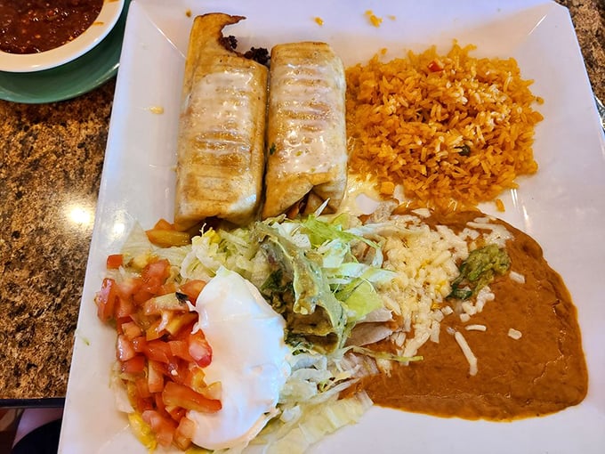 Behold the chimichanga in its natural habitat&mdash;surrounded by a colorful entourage of rice, beans, and fresh toppings. This isn't just lunch; it's an event.