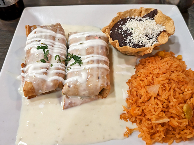 These aren't just chimichangas&mdash;they're crispy golden envelopes delivering messages of joy, swimming in a pool of queso that deserves its own fan club.