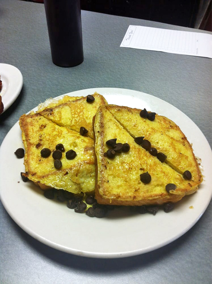 Golden-brown French toast studded with chocolate chips – the breakfast equivalent of finding an extra twenty in your winter coat pocket. Pure, unexpected joy.