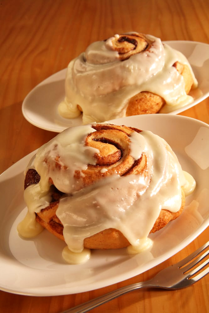 These aren't your mall food court cinnamon rolls. These architectural marvels of dough and icing make mathematicians weep with their perfect spiral precision.
