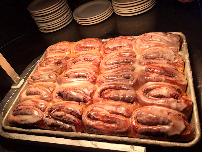 These aren't just cinnamon rolls; they're pillowy spirals of happiness under a glaze so shiny you could check your reflection before diving in.