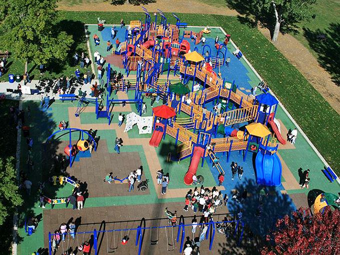 This universal playground isn't just for kids—it's where grandparents can play without the back pain of pushing swings at those fancy big-city parks.