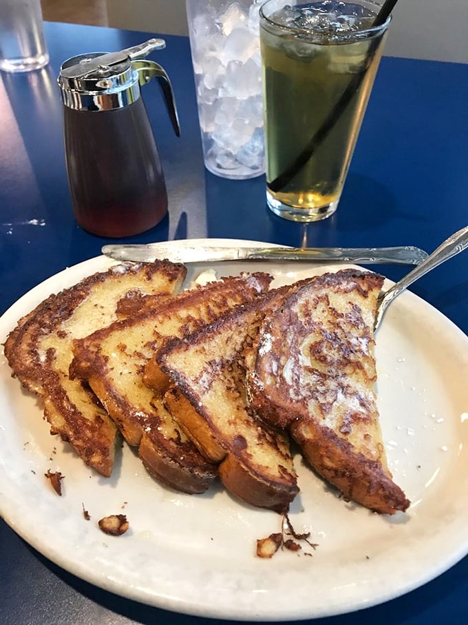 Golden-brown perfection on a plate. This classic French toast has that ideal crispy-outside-custardy-inside ratio that breakfast dreams are made of.