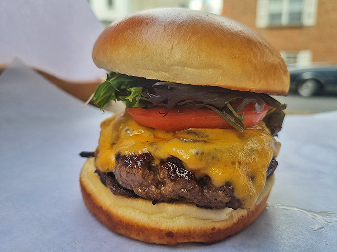 The classic cheeseburger in its natural habitat&mdash;perfectly melted cheese cascading down a hand-formed patty. Poetry on a bun. 
