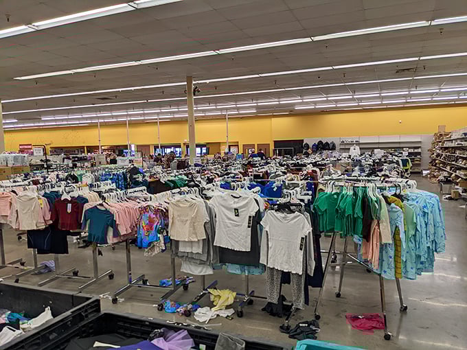 A sea of fashion possibilities where designer dreams meet small-town budgets. Each rack tells a story of retail rescue.