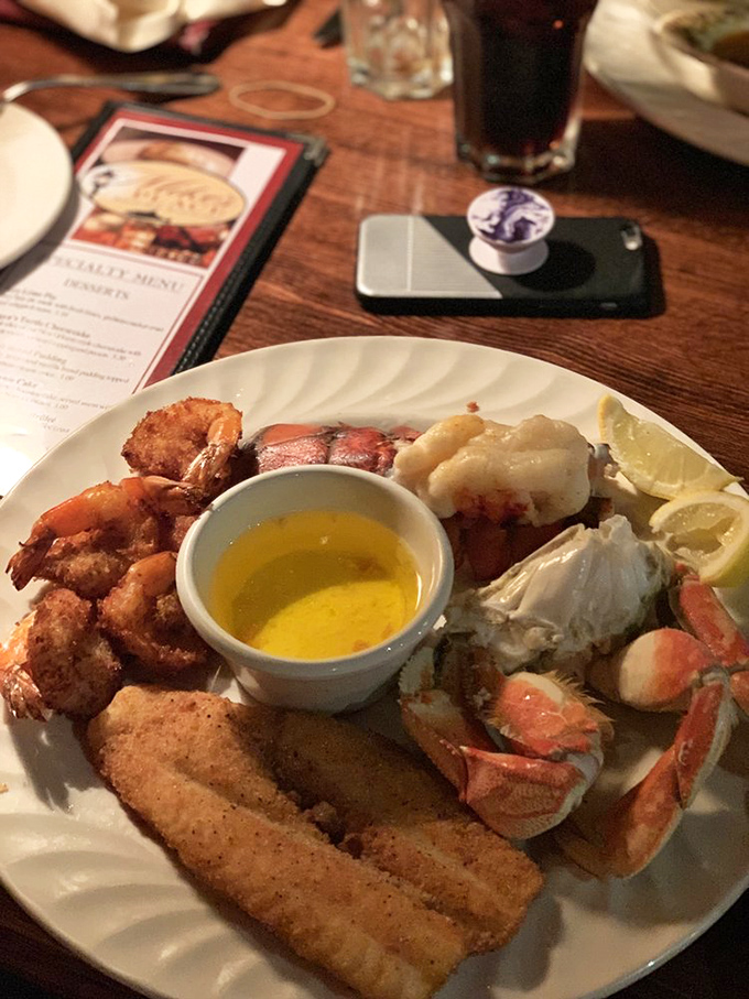 The seafood platter that launched a thousand road trips. Crab legs, fried shrimp, and fish share the spotlight with drawn butter—the unsung hero of seafood feasts.