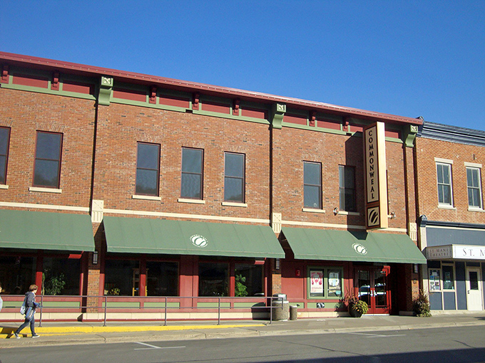 The Commonweal Theatre's brick façade and green awnings anchor downtown, offering cultural nourishment alongside the town's more tangible delights.