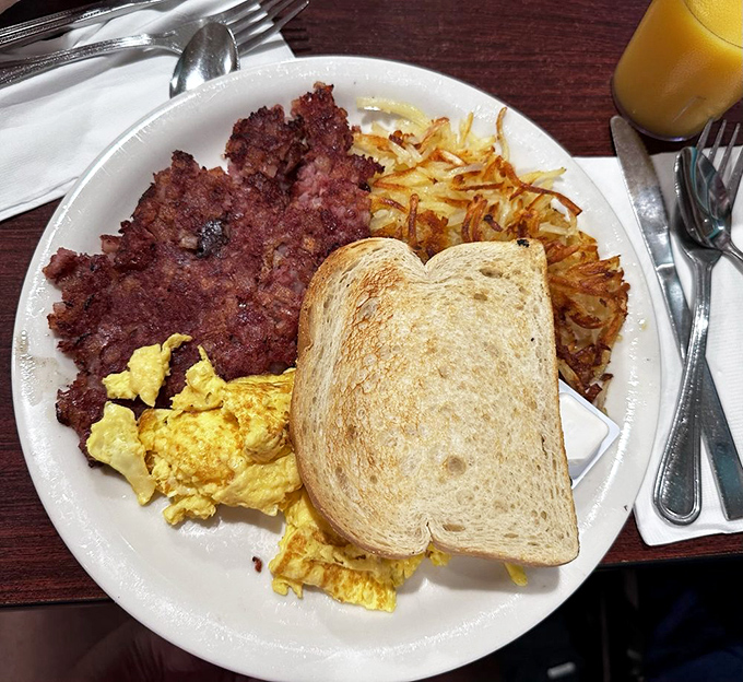 Crispy meets savory in this breakfast trifecta. The corned beef hash achieves that perfect caramelization that makes you wonder why you'd eat anything else.