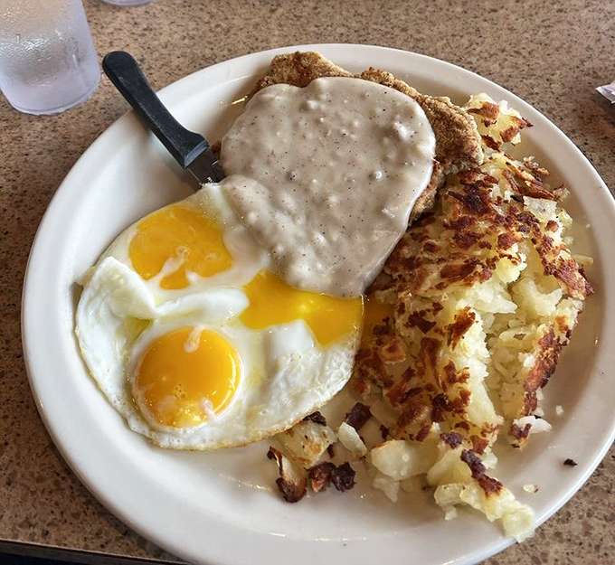 Behold the legendary country fried steak in all its glory&mdash;golden-brown exterior giving way to tender meat, all swimming in gravy that could make a vegetarian reconsider life choices. 