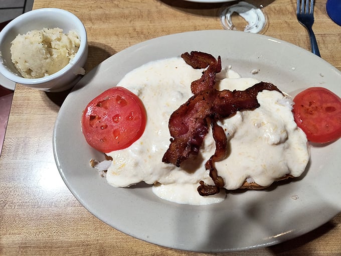 The Hot Brown with bacon doesn't just satisfy hunger&mdash;it reconciles your soul with the universe through the magic of gravy and perfectly crisped bacon. 