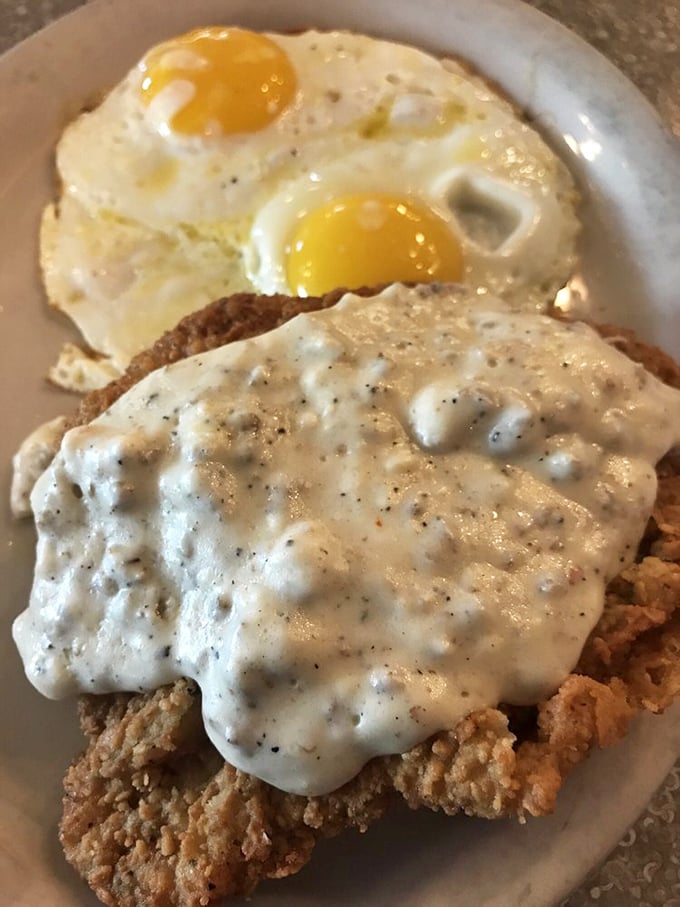 Behold the star attraction &ndash; country fried steak smothered in peppery gravy with sunny-side-up eggs. This plate has launched a thousand food comas and zero regrets.