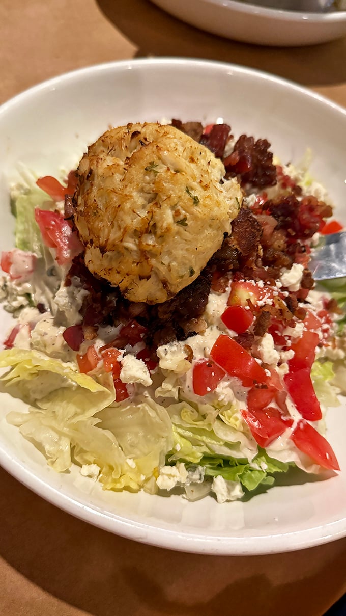 This crab cake perched atop a wedge salad isn't just a topping&mdash;it's the crown jewel in a refreshing masterpiece.