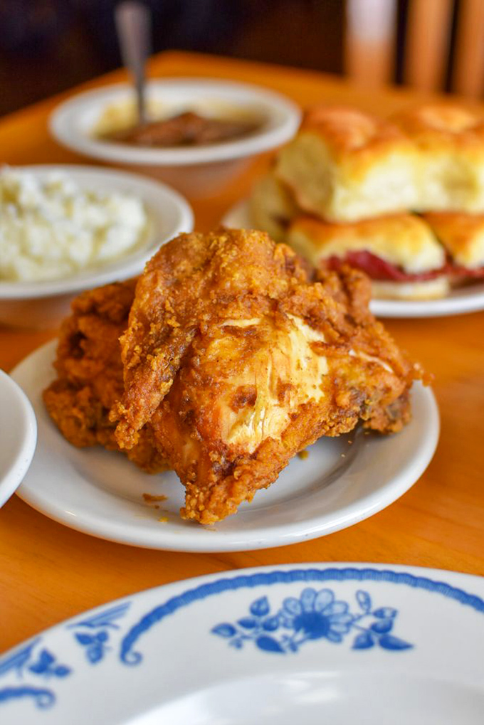 Golden-brown perfection that makes you understand why people line up outside. This isn't just chicken; it's edible nostalgia.