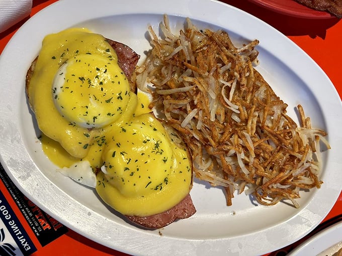 Eggs Benedict that could make a rooster crow with pride, paired with hash browns so perfectly crispy they should be in the Texture Hall of Fame.