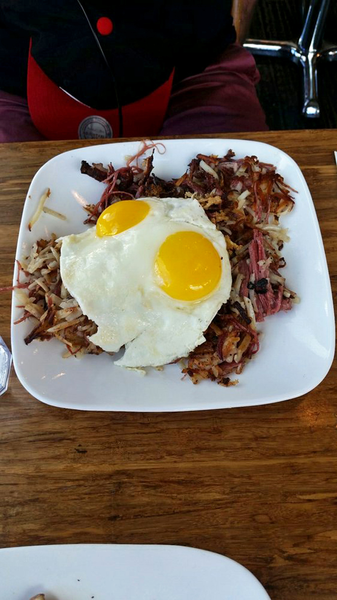 Fried rice topped with Portuguese sausage and sunny-side-up eggs—proof that breakfast fusion isn't just a trend, it's a revelation