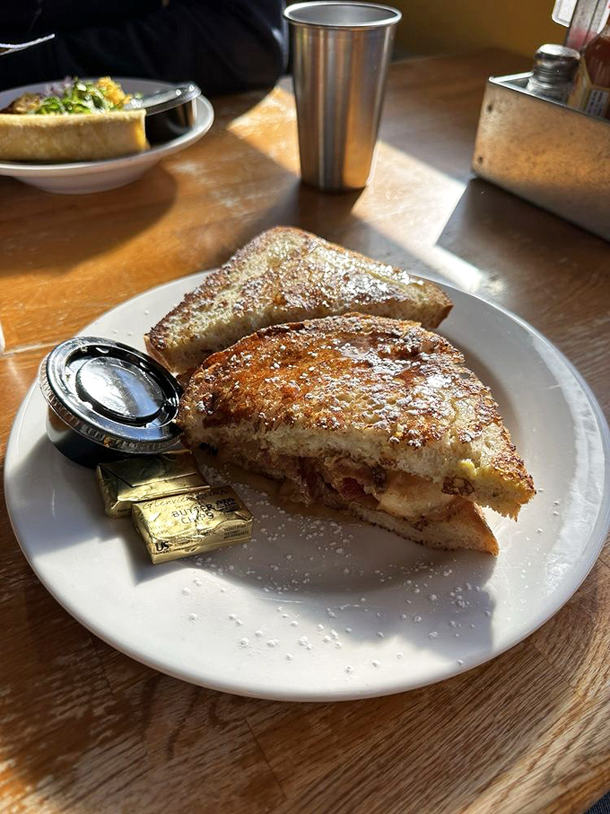 Golden-brown perfection meets powdered sugar snowfall. This French toast sandwich isn't just breakfast &ndash; it's the morning miracle you didn't know you needed.