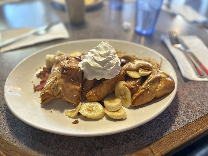 French toast that's had a rendezvous with caramel, whipped cream, and bananas. Breakfast? Dessert? The line blurs deliciously here.
