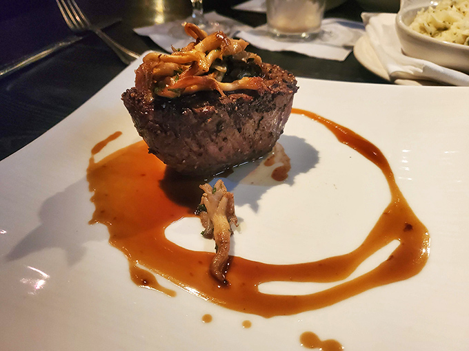 Not just a steak, but a statement. This filet topped with saut&eacute;ed mushrooms sits in a pool of sauce that you'll want to collect with a spoon.