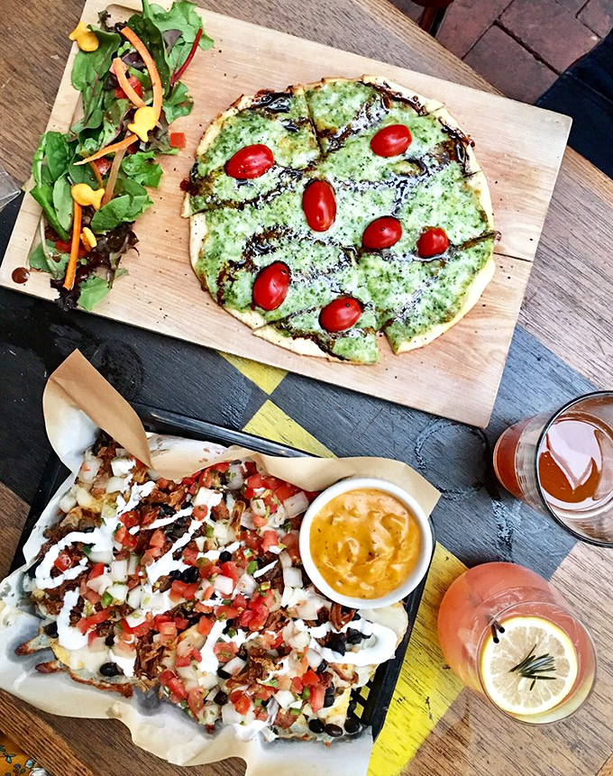 Flatbread that looks like it sailed in from a gourmet galley, paired with loaded nachos that would make Neptune himself resurface for a bite.