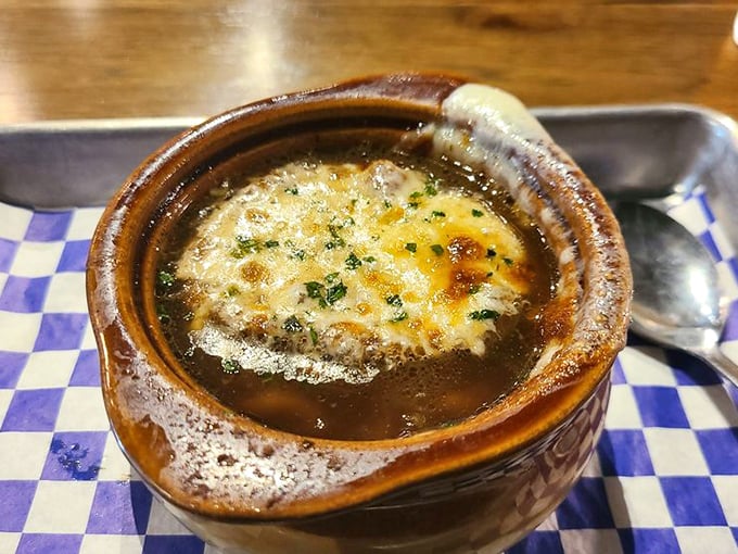 This isn't just soup&mdash;it's a geological marvel with layers of flavor. Bubbling cheese creates a magnificent ceiling above a cavernous depth of savory broth.