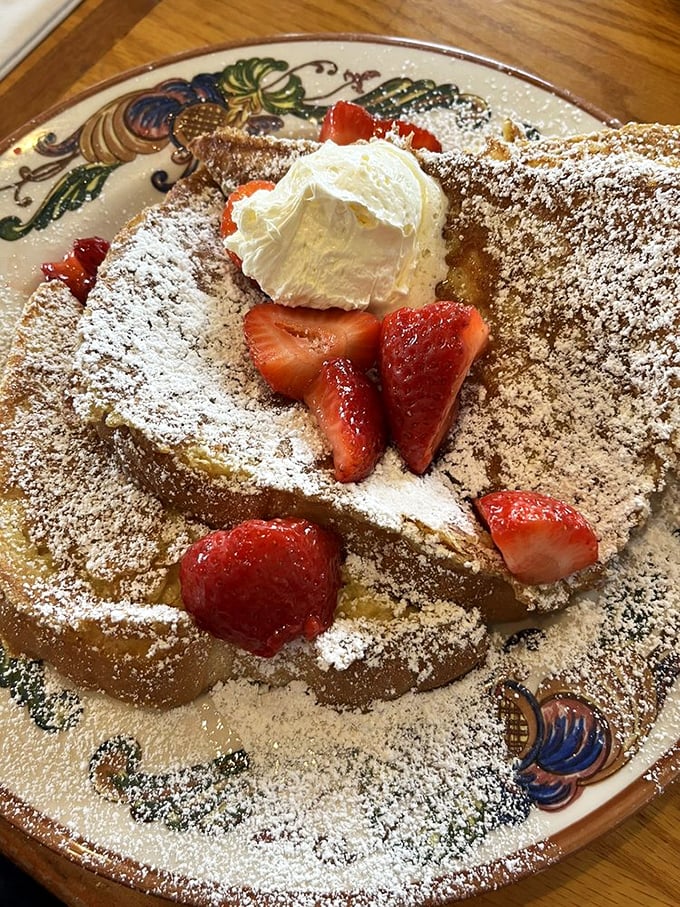 French toast nirvana has been achieved! Powdered sugar snow, fresh strawberries, and whipped cream transform breakfast into an event worth traveling for.