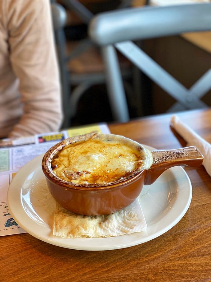 Behold the legendary French onion soup—that cheese pull could win Olympic medals, while the broth beneath deserves its own Pennsylvania historical marker.