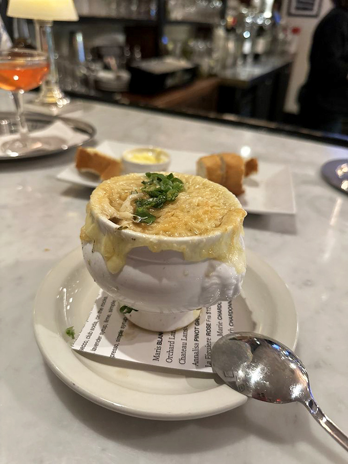 Behold the holy grail of comfort food: French onion soup with a cheese pull that deserves its own Olympic medal.