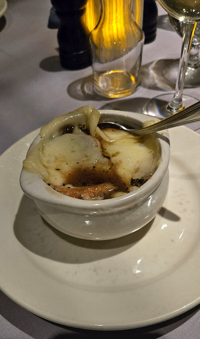 This isn't just soup&mdash;it's a geological wonder with layers of melted cheese stretching skyward like the world's most delicious game of Jenga.