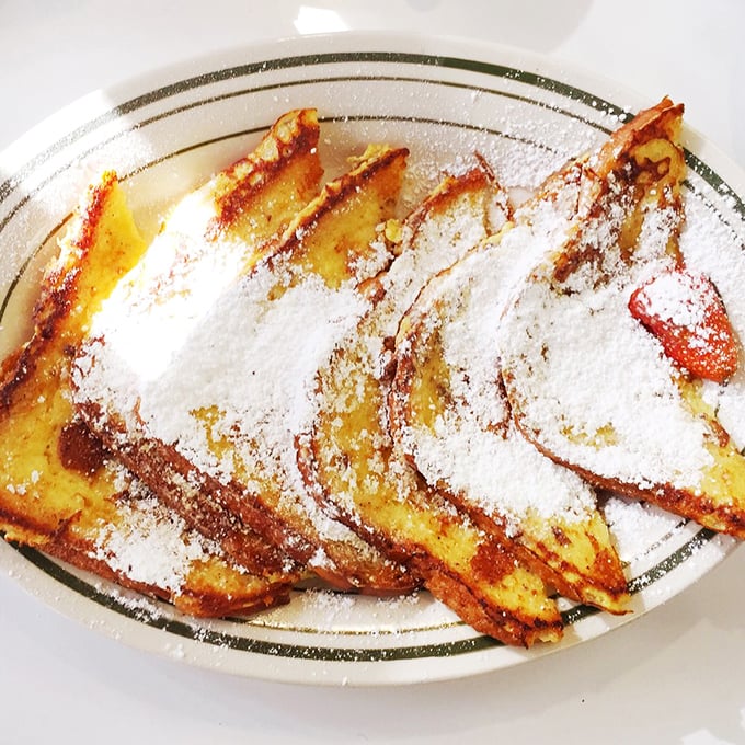 French toast that would make actual French people renounce their citizenship. Golden, crispy edges giving way to custardy perfection - breakfast nirvana achieved!