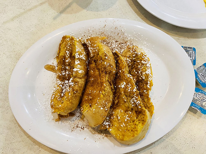 Golden-brown French toast dusted with cinnamon and powdered sugar&mdash;simple perfection that proves sometimes less really is more.