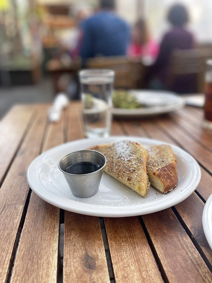 Behold the Hazelnut Challah French Toast in its natural habitat. That dusting of powdered sugar isn't decoration—it's a snowfall of joy.
