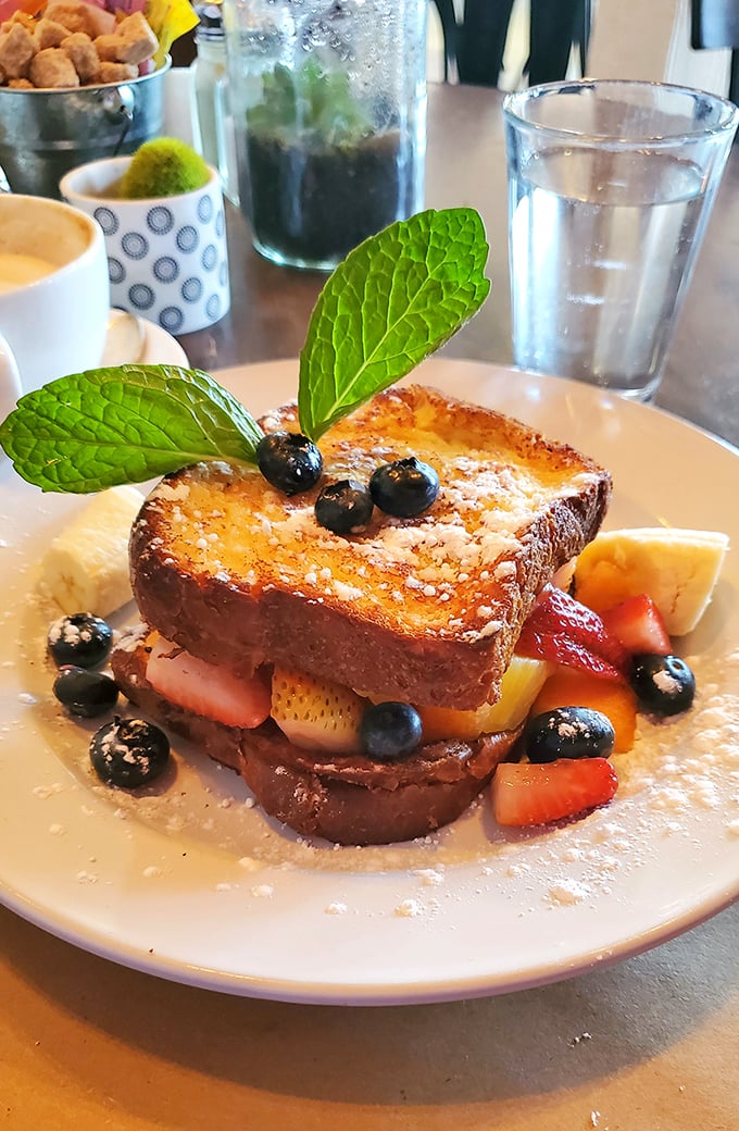 This French toast isn't just breakfast—it's edible architecture, layered with fresh berries and crowned with mint. Proust had his madeleine; I have this.