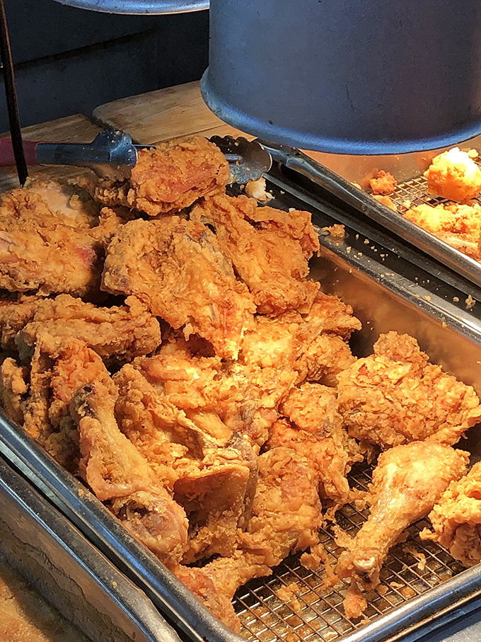 Golden-crusted chicken waiting in warm embrace, proving that patience isn't just a virtue &ndash; it's the secret ingredient to perfect Southern fried chicken.