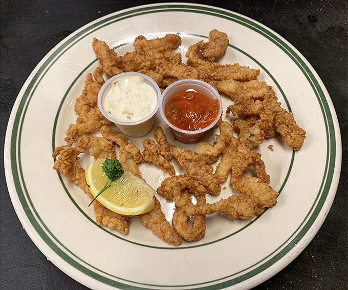 Golden, crispy perfection on a plate. These fried clams are what seafood dreams are made of&mdash;tender morsels with just the right crunch.
