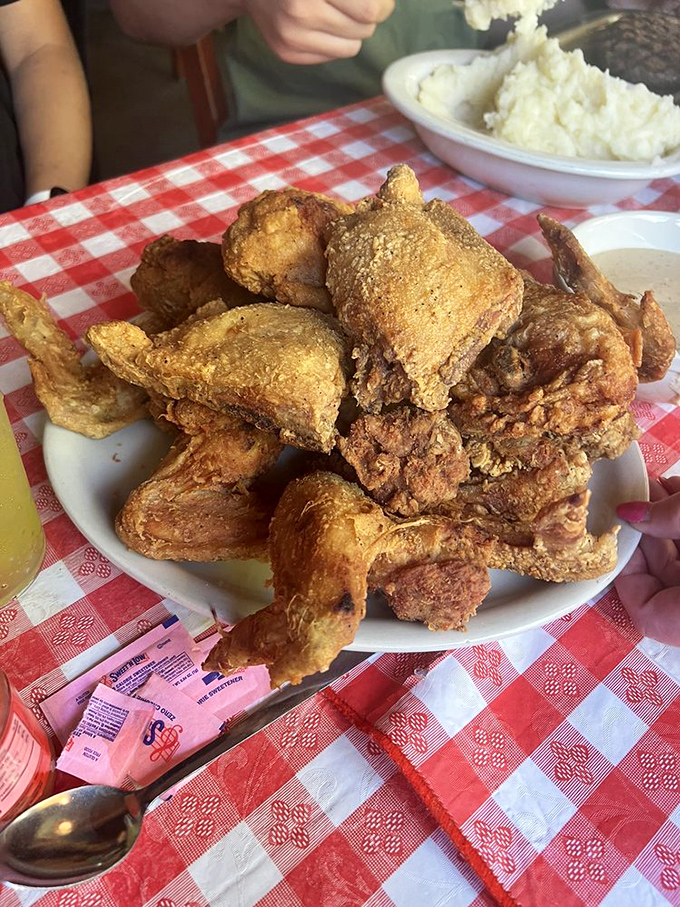 Golden-brown perfection that makes first-time visitors wonder where this chicken has been all their lives.