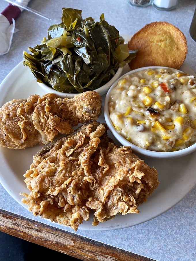 Golden-brown chicken with that perfect crunch, paired with collards and creamy corn. Comfort food that hugs your soul.