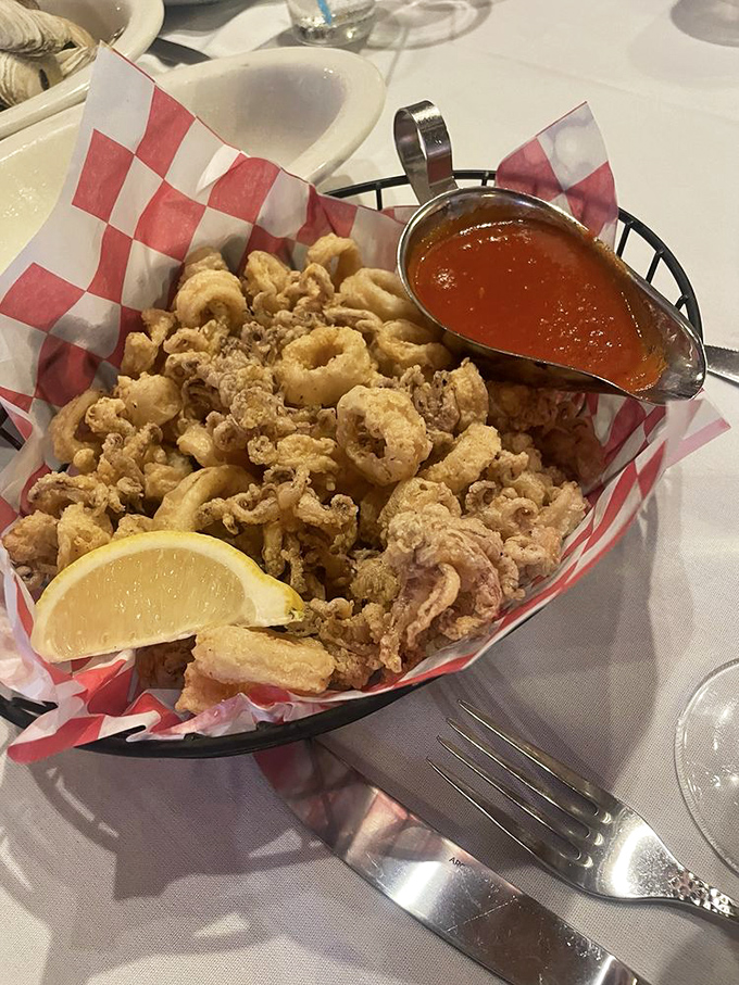 Golden-fried perfection in a checkered basket. These crispy morsels aren't just appetizers&mdash;they're little nuggets of happiness that make waiting for your entr&eacute;e a pleasure, not a chore.