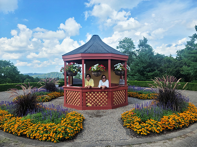 A peaceful gazebo surrounded by vibrant flowers offers a moment of Zen. The perfect spot to contemplate life's big questions or just rest your feet.