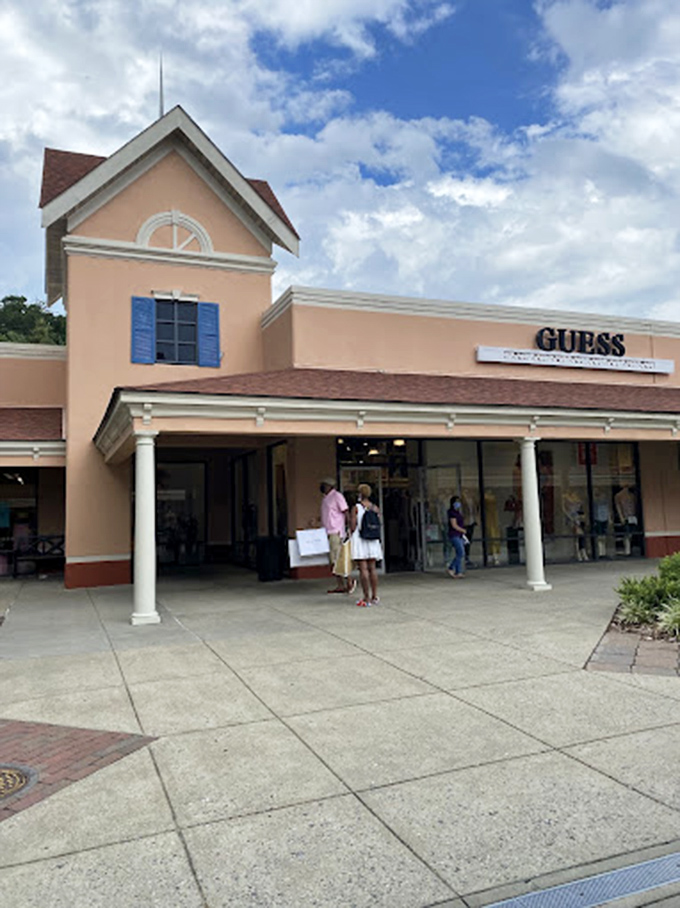 The Guess storefront, with its classic colonial architecture, proves that hunting for fashion deals can happen in surprisingly picturesque settings.